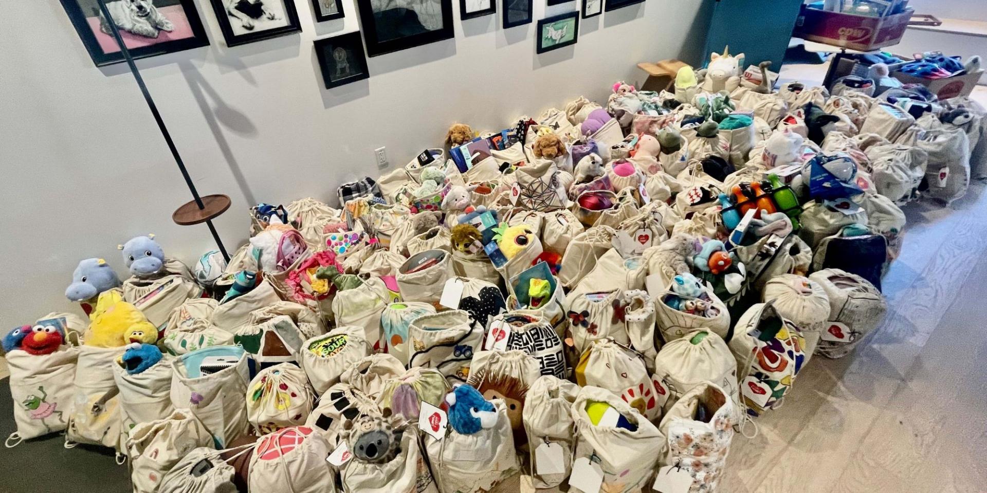 10th Annual Warm a Heart Drive Packs Totes and a Whole Lot of Love in ...